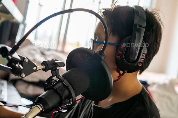 Unidentified young boy recording at home. Stock Photo by ellinnur ...