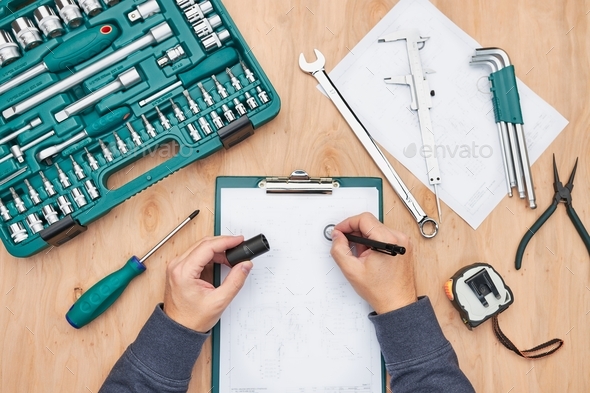 Workshop table with many tools. Wrench, spanner, calliper and ratchet ...