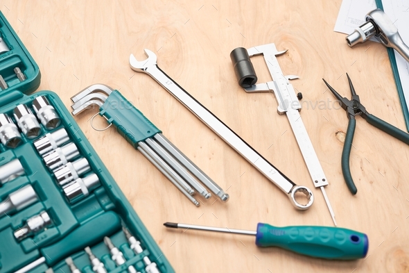 Workshop table with many tools. Wrench, spanner, calliper and ratchet ...