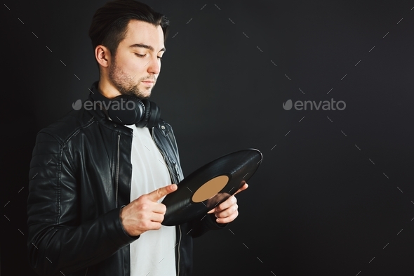 Music vinyl record. Man holding vinyl record disc. Vintage music style ...