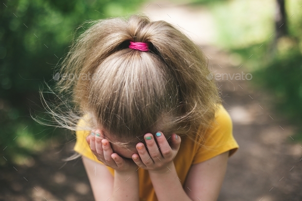 Unhappy preteen girl crying Stock Photo by olesyaklyots | PhotoDune