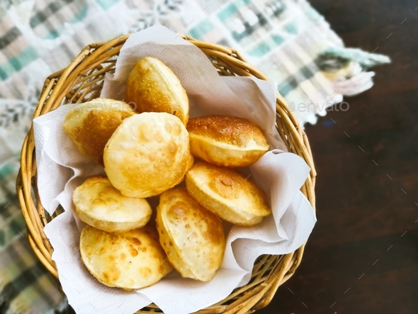 top view of fried poori bread in a basket Stock Photo by ellinnur ...