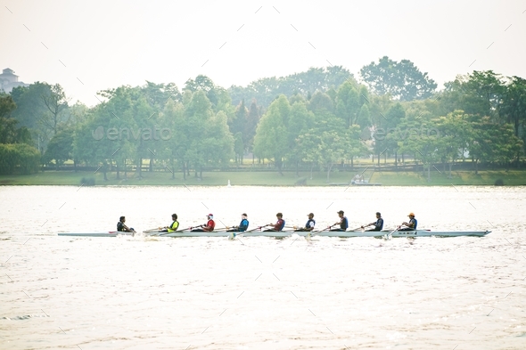 group of people paddling the kayak together during training Stock Photo ...