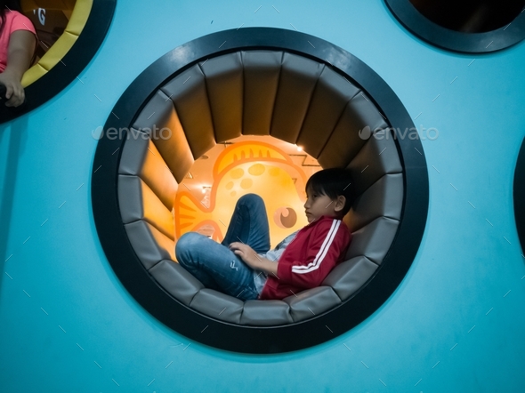 young boy sitting in a circle pod Stock Photo by ellinnur | PhotoDune