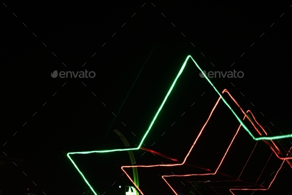 colourful neon lights structures at night Stock Photo by ellinnur