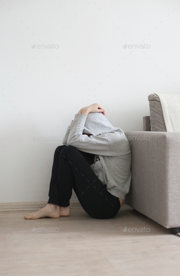 Mental health - woman sitting at the floor having emotional breakdown ...