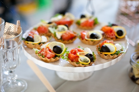 fancy appetizers buffet - tartlets with olives and salmon on the big ...