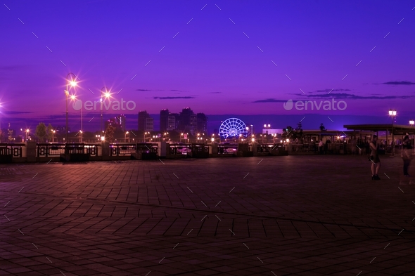 Purple color - city after sunset at dusk with streetlights on and a ...