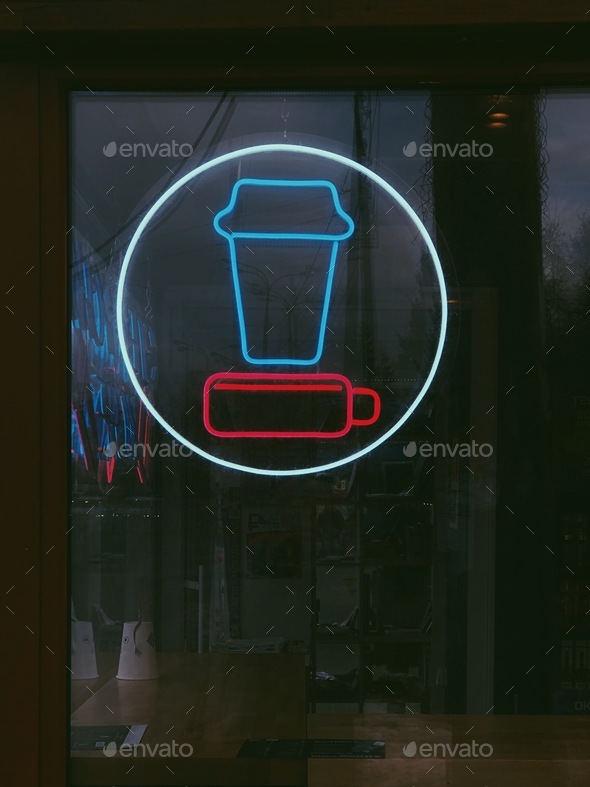Neon sign of coffee to go and battery on the window of small coffee ...