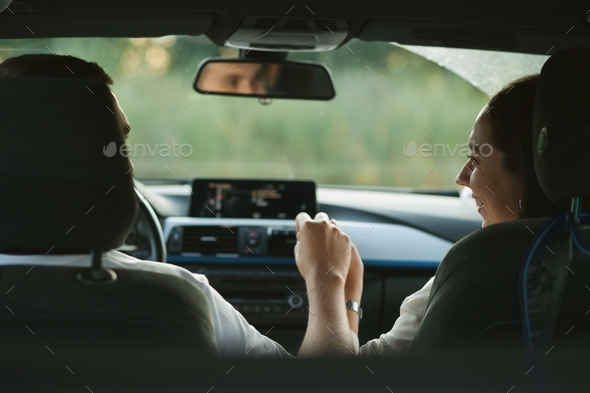 Couple in love in a car holding hands, love gesture and symbol, family ...