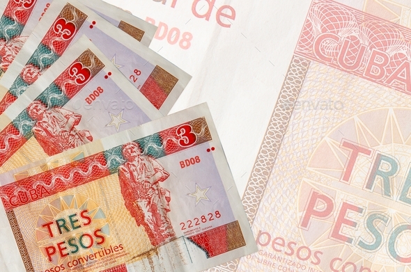 3 cuban pesos convertibles bills lies in stack on background of big ...