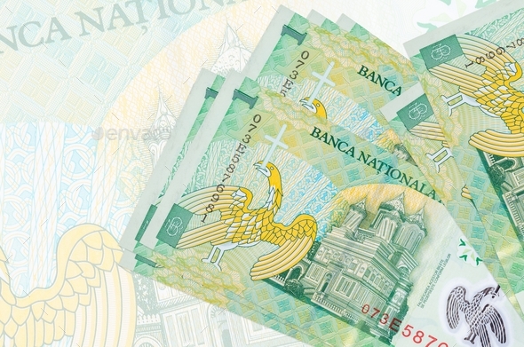 1 Romanian leu bills lies in stack on background of big semi ...