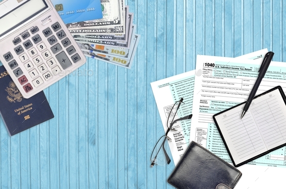 IRS form 1040 Individual income tax return lies on flat lay office ...