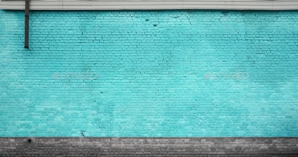 The texture of the brick wall of many rows of bricks painted in cyan ...