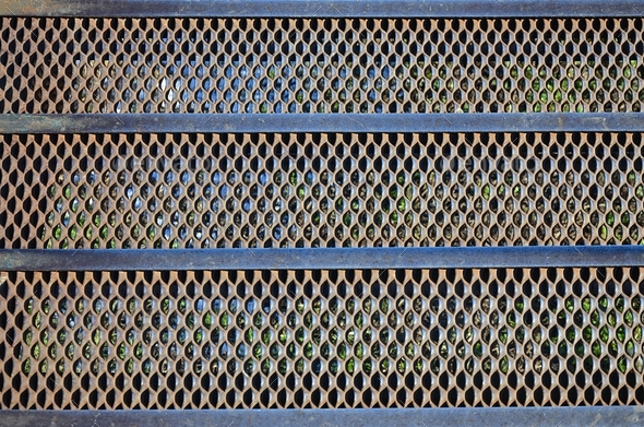 Texture steps of rusty metal mesh in the sections of the metal strips ...
