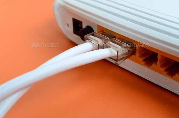 The Internet cable plugs are connected to the Internet router Stock ...