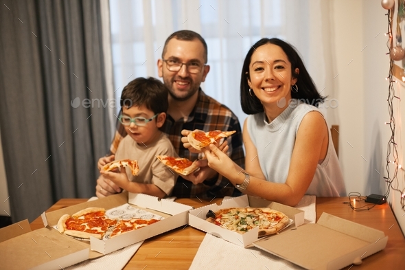 happy family eating pizza at home, pizza delivery and candid everyday ...