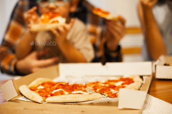 happy family eating pizza at home, pizza delivery and candid everyday ...