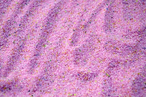 Texture of a colored granular sand close up. Pink grains Stock Photo by ...