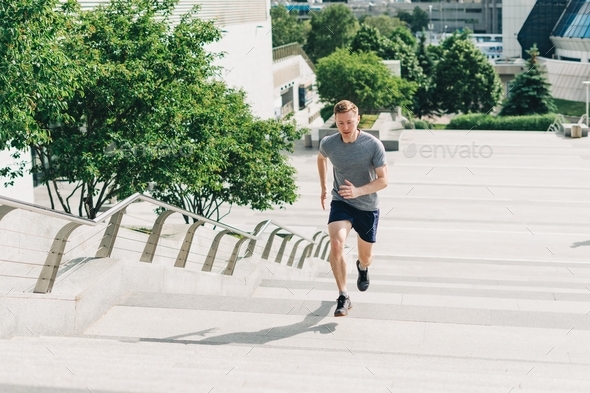 Man run up stairs. Athlete outdoors. Sport and healthy concept Stock ...