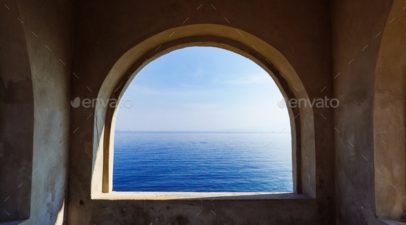 Minimalist architecture of an Arched window overlooking blue sea. Stock ...