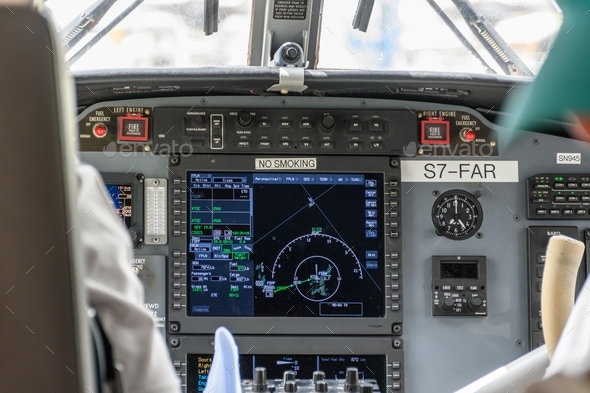 Close-up photo of aircraft cockpit with radar screen and gauges in ...