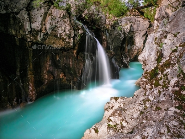 Long exposure image of beautiful turquoise stream and waterfall in ...