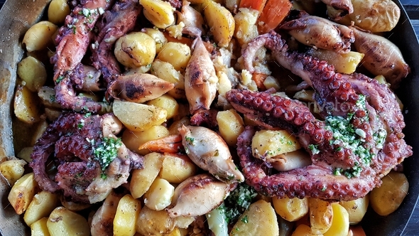 Overhead, top view of delicious sea food. Octopus, calamari and ...
