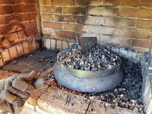 Hand spreading ember on open fire and ember roast. Stock Photo by 9 ...