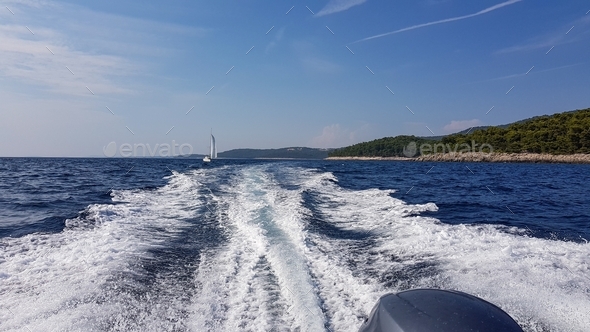 Back view of motorboat making waves on sea surface. Blue, water, summer ...
