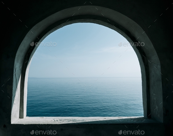 Minimalist architecture of an Arched window overlooking blue sea. Stock ...