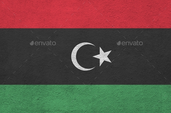 Libya flag depicted in bright paint colors on old relief plastering ...