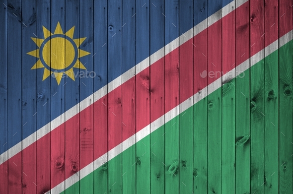 Namibia flag depicted in bright paint colors on old wooden wall close ...