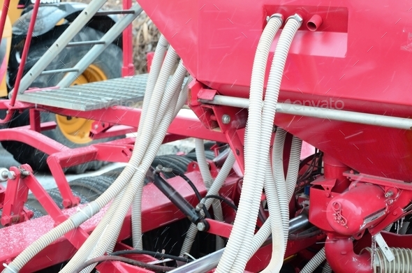 Springs and tubes are arranged in a row. A row of seeder. Heavy ...