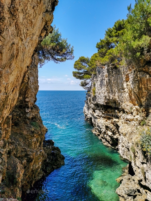 Beautiful cove with turquoise and blue sea water. Stock Photo by 9_fingers_