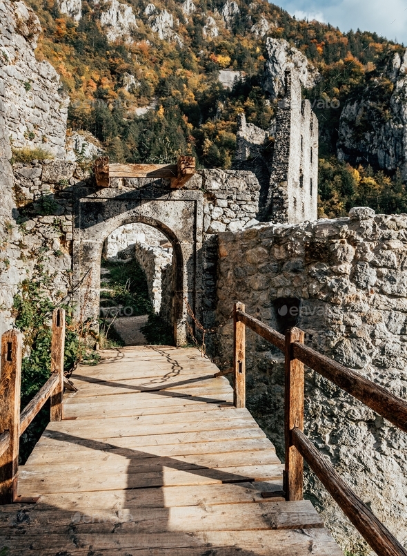 Wooden footbridge in Medieval castle ruins in autumn. Stock Photo by 9 ...