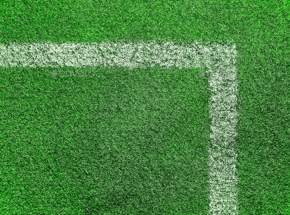 Directly above, top view image of white corner line on green football ...