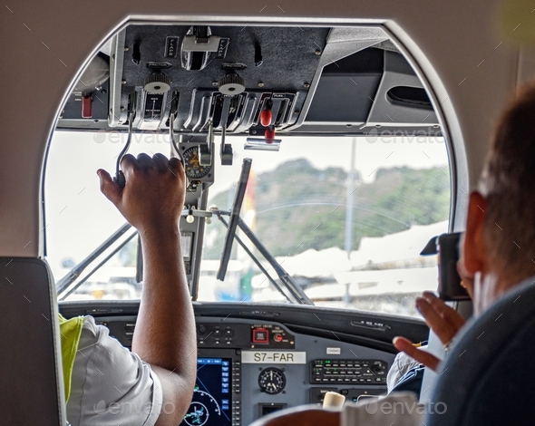 Pilot cockpit of a passenger jet, aircraft. Pilot flying, inside of ...