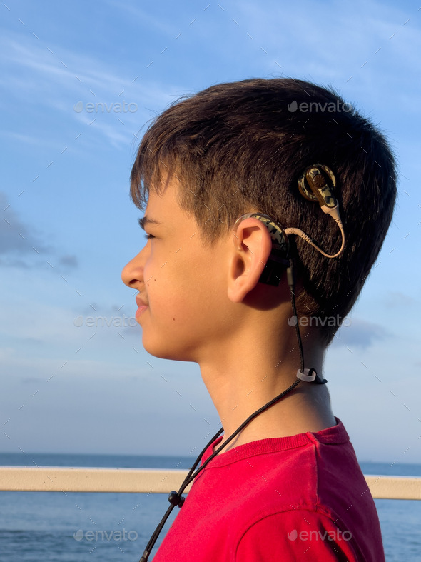 deaf boy with cochlear implant Stock Photo by bodenchuknata | PhotoDune