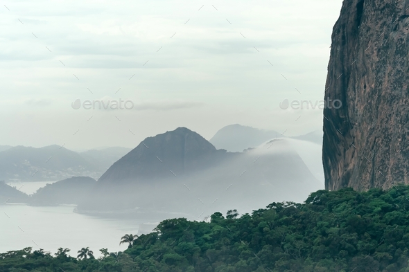 Foggy morning in Rio dee Janeiro, mountains view Stock Photo by vinnikava