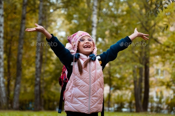 Happy girl going home from school Stock Photo by natanavo | PhotoDune