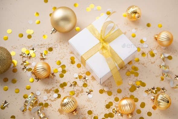 new year celebration beige color background with golden decor balls ...