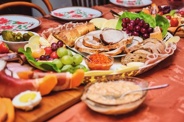 Close-up image of dinner table full of various food. Stock Photo by ...