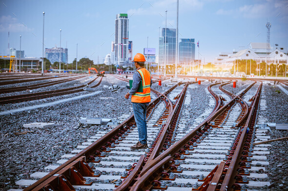 Engineer railway under inspection and checking construction railway ...