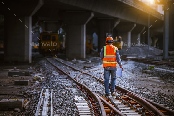 Engineer railway under inspection and checking construction railway ...