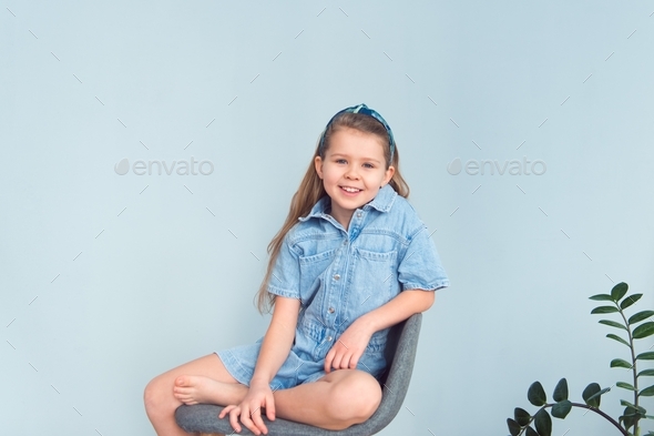 Cute 8 years old girl smile and look at camera Stock Photo by shapoval08
