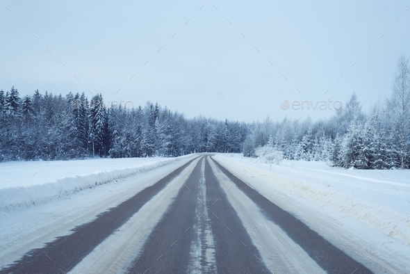 open road winter nature - trees under snow Stock Photo by shapoval08