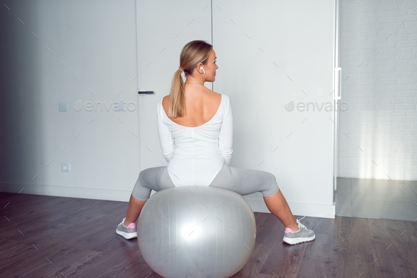 Woman in white body sit on fitball Stock Photo by shapoval08 | PhotoDune
