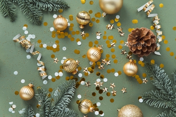 Festive green color background with confetti and golden balls for ...
