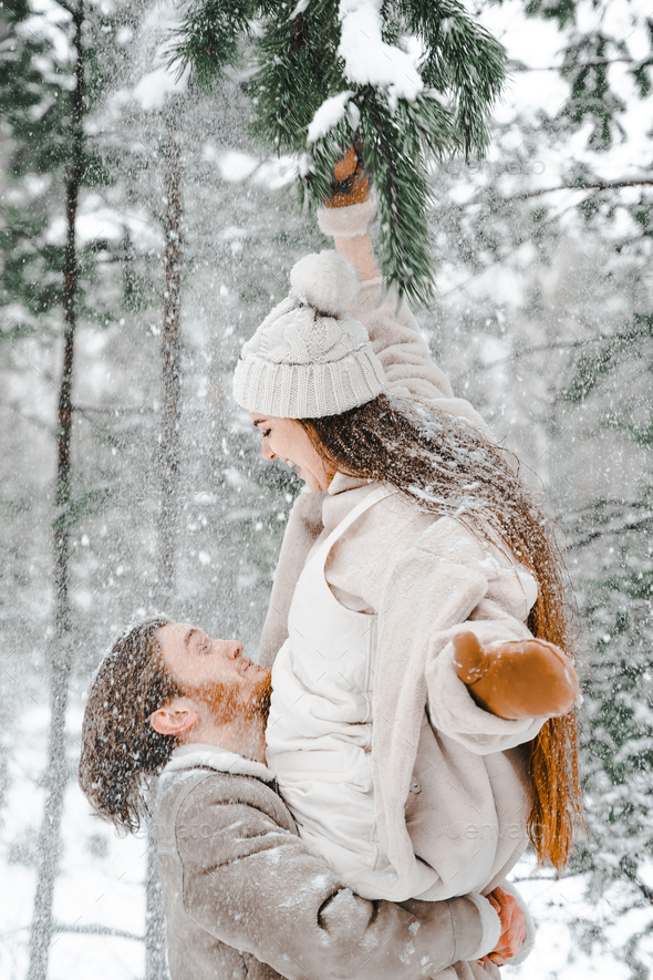 Romantic snow love story.Young couple guy girl lying,playing in snowy ...
